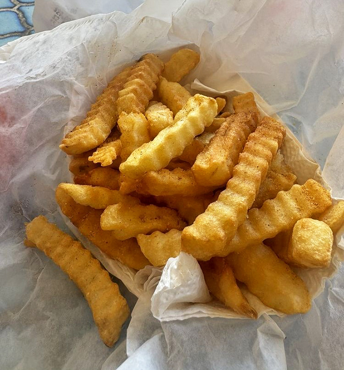 These aren't just fries &ndash; they're strategic heat-management tools disguised as a side dish. Crispy, seasoned, and essential for your hot chicken adventure.