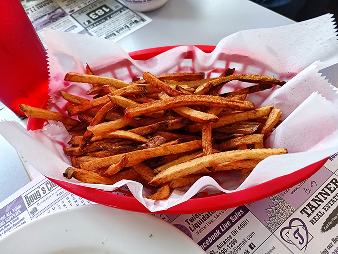 These aren't just french fries; they're crispy potato time machines that transport you back to when calories didn't count and ketchup was considered a vegetable.