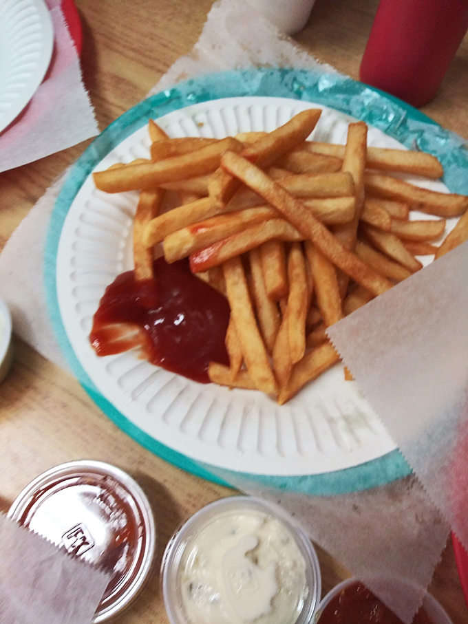Chips, not fries—thick, substantial, and unapologetically potatoey. These aren't those wimpy shoestrings; these are proper British soldiers ready for duty.