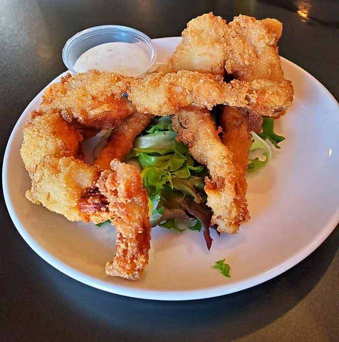 These crispy onion rings aren't just a side dish – they're practically an art form, with that ideal crunch-to-tenderness ratio.