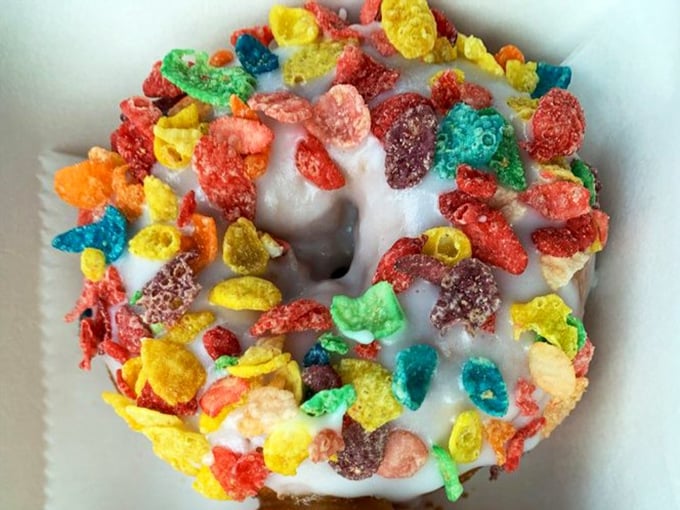 Fruity Pebbles on a donut? Somewhere, Fred Flintstone is weeping with joy at this technicolor tribute to breakfast nostalgia.