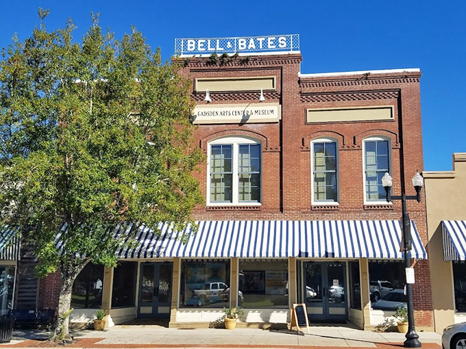 The Bell & Bates building houses Gadsden Arts Center, where culture thrives behind classic brick and striped awnings&mdash;no pretentiousness required.