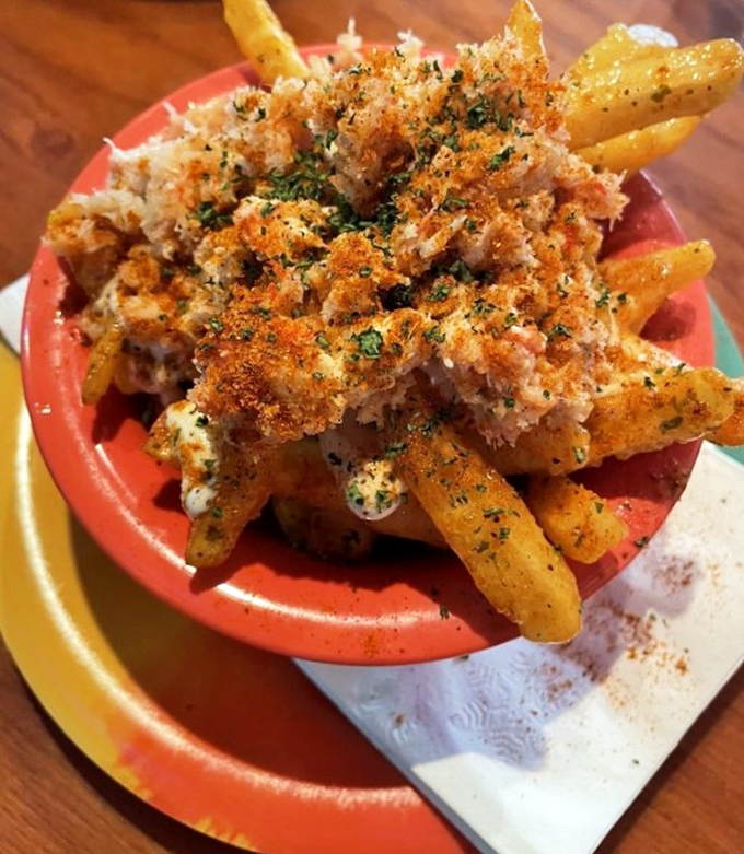 Behold the garlic crab fries &ndash; where French fries went to finishing school and graduated with honors in decadence.