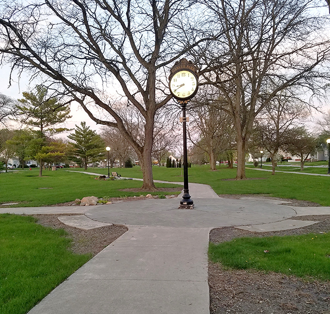 A town clock in a park is the ultimate "slow down and enjoy life" reminder. No one ever regretted spending time on these benches.