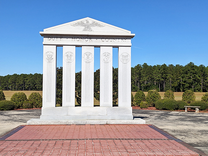 Duty, Honor, Country etched in marble at Georgia Veterans Memorial&mdash;a solemn reminder of sacrifice amid the peaceful Georgia pines.