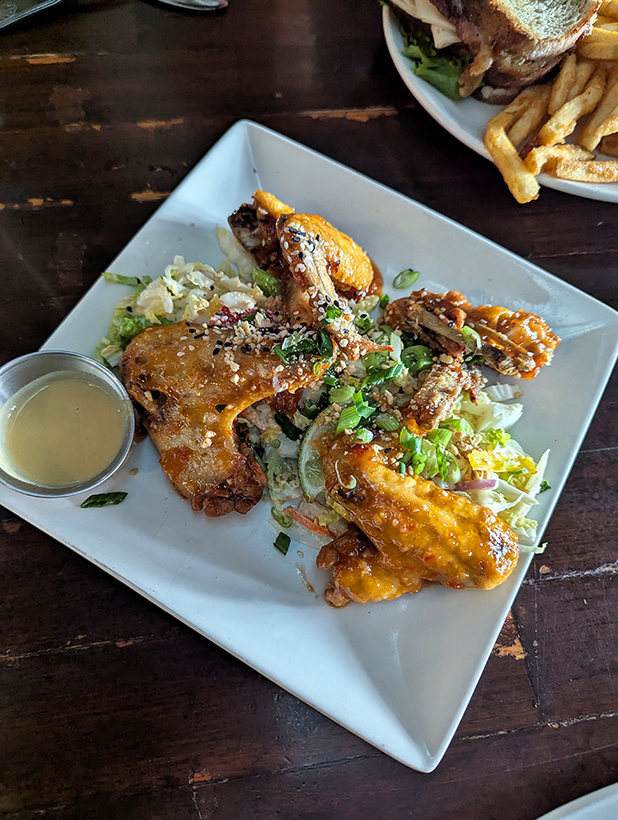 Glazed chicken wings that strike the perfect balance between sweet, spicy, and "I need to order another plate immediately."