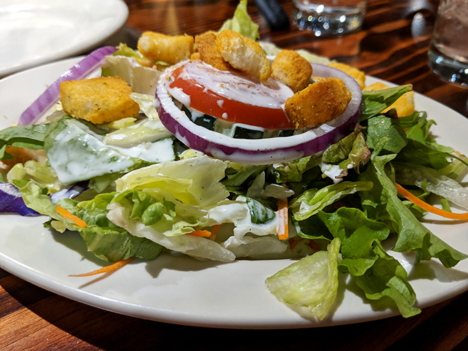 A crisp garden salad that doesn't apologize for being healthy&mdash;it just shows up with purple onions and croutons like welcome party guests.
