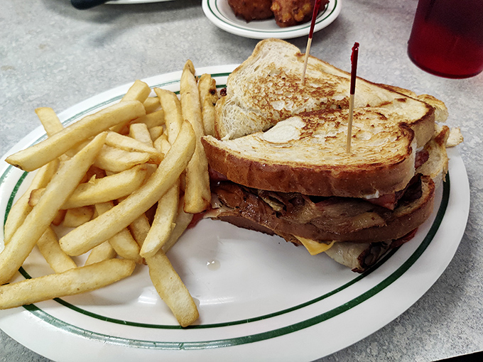 The humble grilled cheese sandwich, elevated to art form. That golden-brown crust is the sound of childhood memories crunching with every bite.
