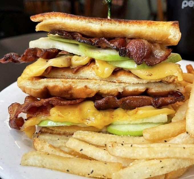 This isn't just a sandwich&mdash;it's architecture. Layers of melted cheese and perfectly toasted bread with home fries that refuse to be sidekicks.