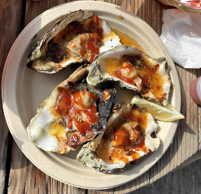 These grilled oysters aren't just seafood&mdash;they're little volcanic islands of flavor erupting with savory butter and tangy sauce.