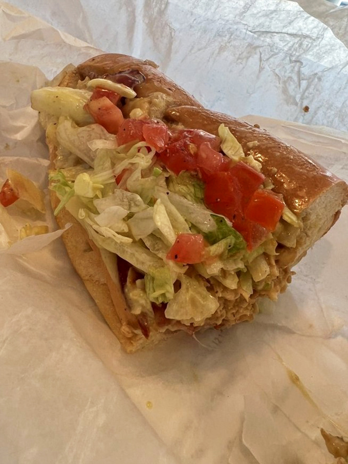 Lettuce, tomato, and chicken living in perfect harmony. This isn't just a sandwich&mdash;it's an architectural achievement of flavor balance.
