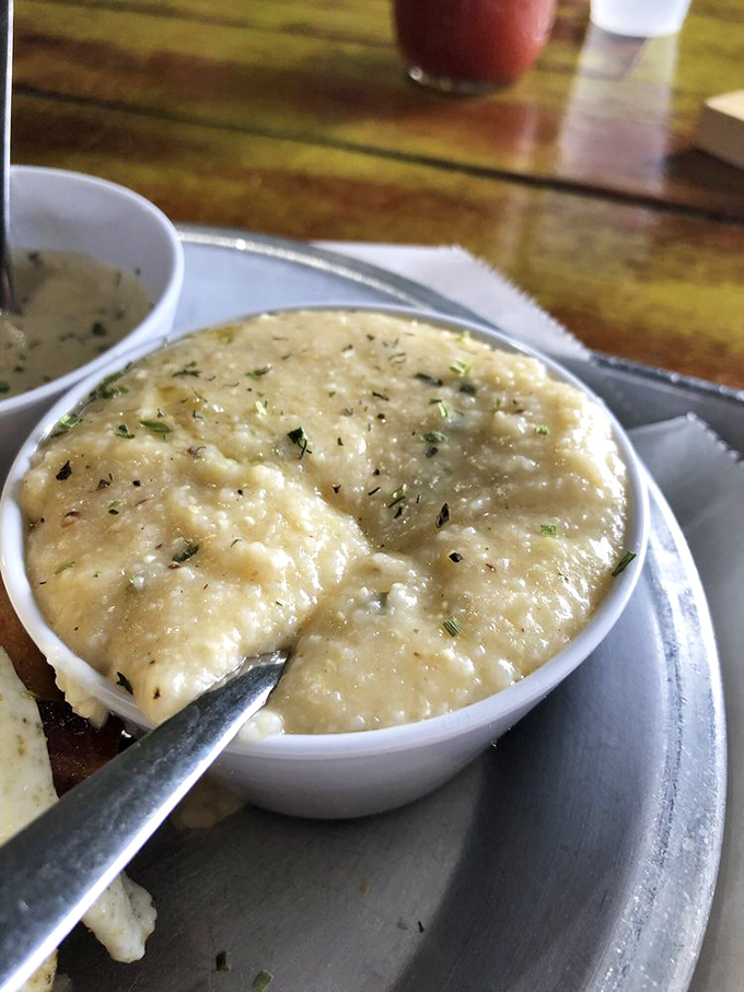 Creamy grits that look so velvety smooth they could double as a spa treatment for your taste buds. Flecks of herbs add both color and promise.