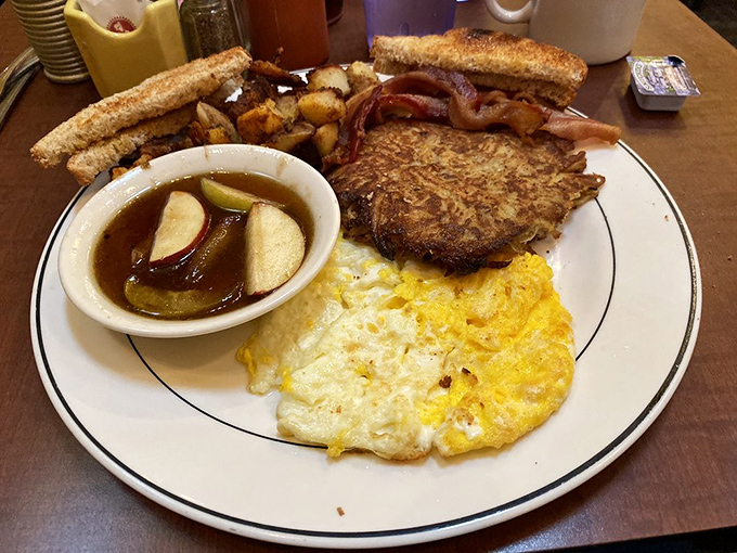 The Grumpy Special: where indecision becomes a virtue. Eggs, potatoes, toast, and what appears to be a potato pancake&mdash;because why choose when you can have it all?