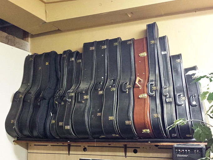 Guitar cases that once protected the instruments of weekend warriors and coffee shop crooners await their next musical adventure.