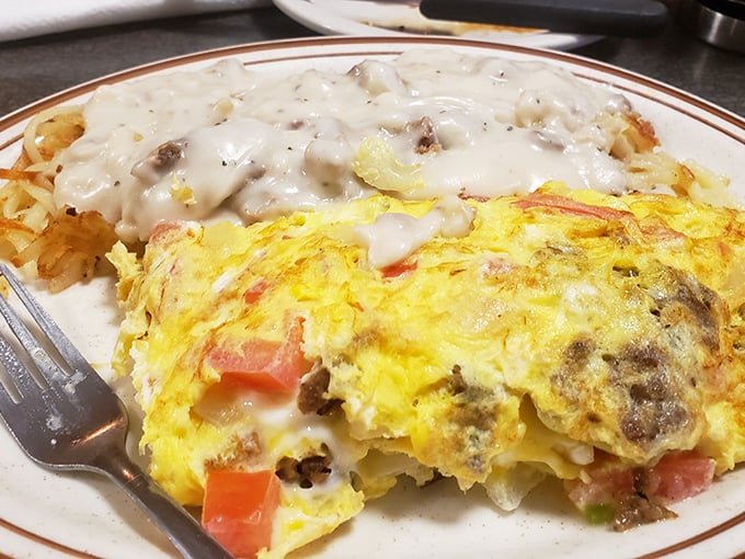When breakfast can't decide what it wants to be, you get this glorious mashup&mdash;an omelet with hash browns smothered in country gravy.