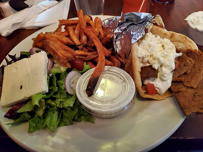 The gyro platter arrives loaded with Mediterranean goodness that would make Zorba himself dance with joy.
