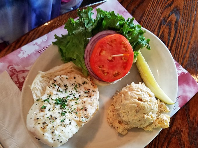 Simple perfection on a plate: a pristine piece of halibut, expertly prepared. The potato salad sidekick isn't just playing a supporting role—it's gunning for stardom.