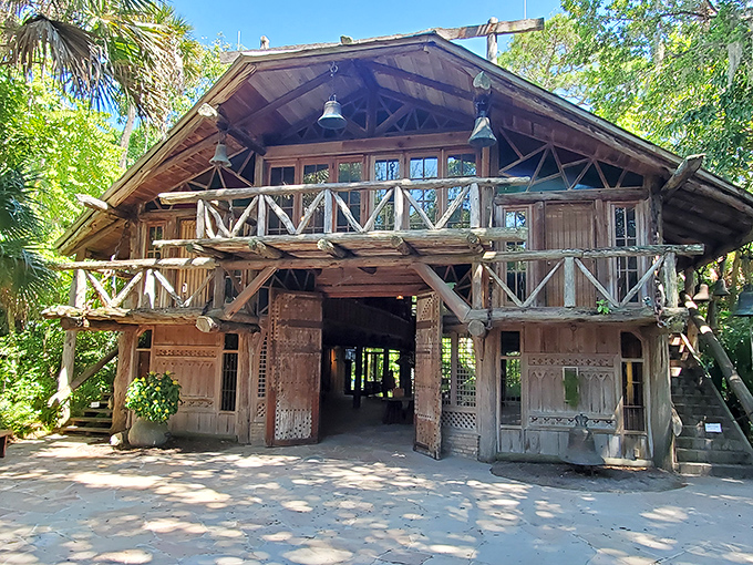 The Hall of Giants welcomes visitors with rustic grandeur. This architectural gem blends seamlessly with its jungle surroundings.