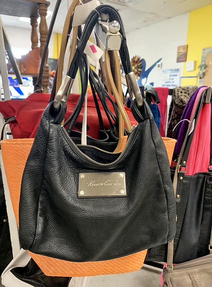 Handbag heaven alert! That Kenneth Cole leather beauty hanging among friends proves that designer labels and budget shopping aren't mutually exclusive concepts at Encore.