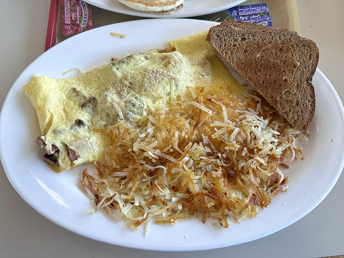 This omelet and hash browns combo isn't just breakfast&mdash;it's edible sunshine that'll fuel your day better than any energy drink.