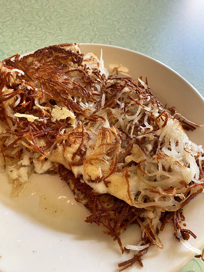 Crispy, golden hash browns that shatter like glass when your fork hits them&mdash;these aren't just potatoes, they're a textural revelation.