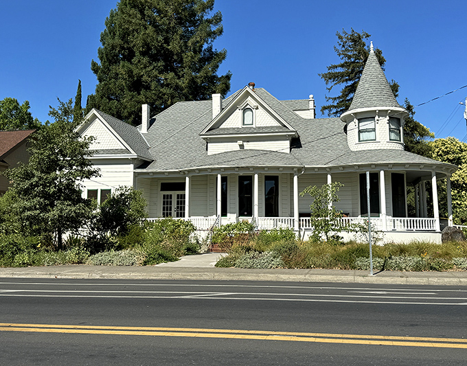 This Victorian beauty stands as proudly as your grandmother at her 90th birthday party, white picket fence and all.