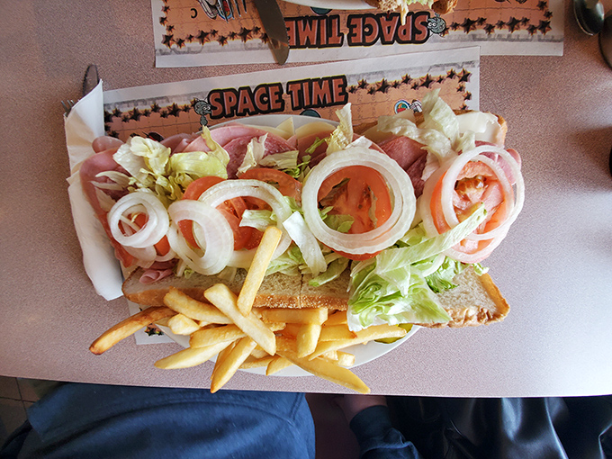 This isn't just a sandwich&mdash;it's an open-faced love letter to fresh ingredients, with rings of onion arranged like Olympic symbols atop quality ham.