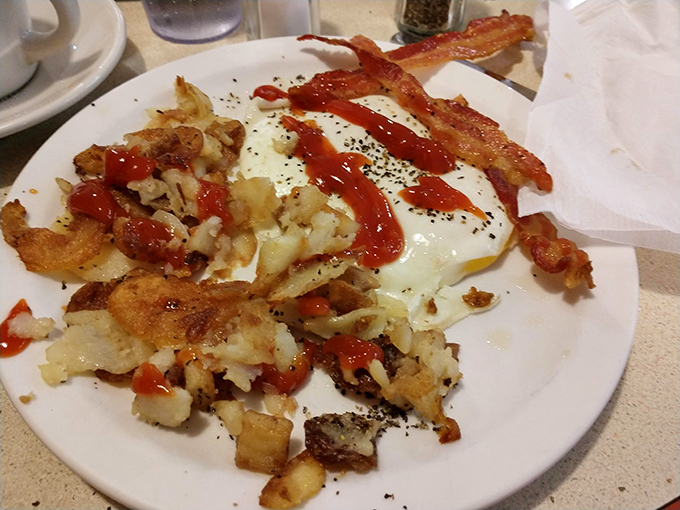 Breakfast potatoes with an identity crisis&mdash;part hash browns, part home fries, all delicious. The ketchup zigzag adds that touch of Midwestern abstract expressionism. 