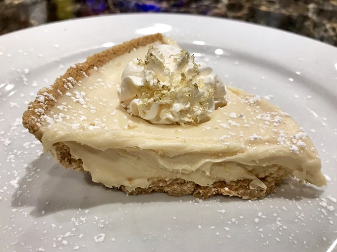 This isn't just pie&mdash;it's a cloud of creamy perfection on a graham cracker crust, dusted with powdered sugar like freshly fallen snow.