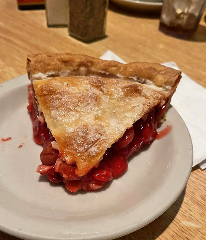 Cherry pie that would make Agent Cooper from Twin Peaks weep with joy. That flaky crust is holding back a ruby red tide of fruity perfection.