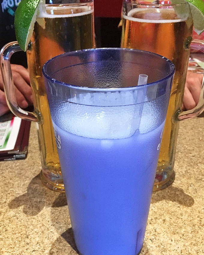 The electric blue horchata alongside golden beer mugs creates a beverage landscape as diverse and beautiful as Arizona itself.