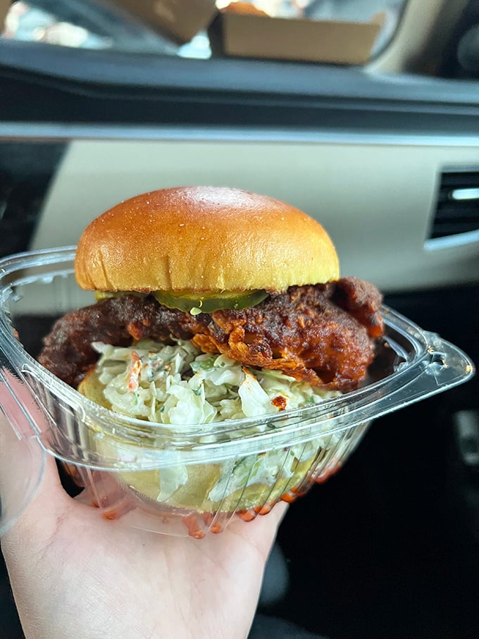 The hot chicken sandwich: where crispy coating meets cool slaw in perfect harmony. A handheld masterpiece that demands both napkins and respect.