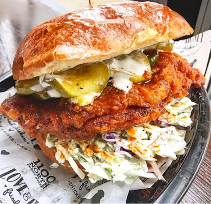 The Nashville hot chicken sandwich: where fiery spice meets cooling slaw in a dance that makes your taste buds the happiest third wheel.