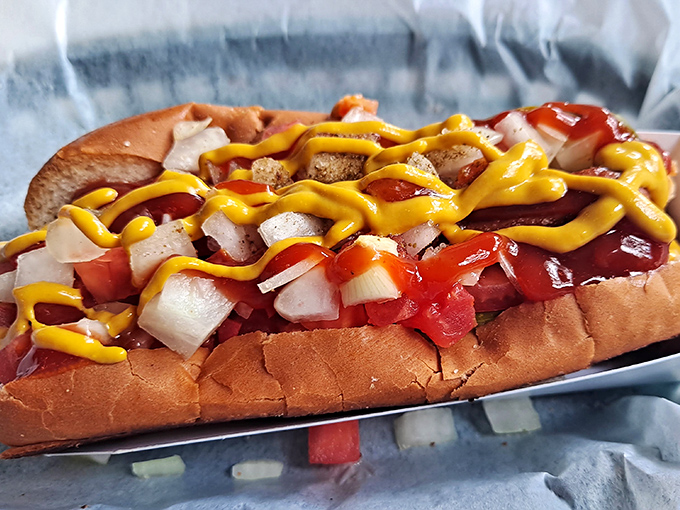 Hot dog architecture at its finest! This isn't just a hot dog—it's a canvas of toppings that transforms the humble frankfurter into edible art.