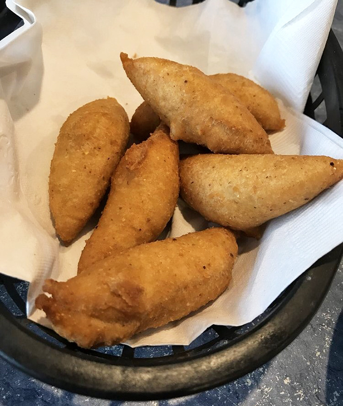 Hush puppies so perfectly golden they deserve their own trophy. Crisp exterior, pillowy interior—the unsung heroes of every seafood feast.