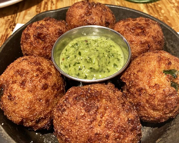 These hush puppies aren't asking for silence&mdash;they're demanding attention. Crispy orbs of cornmeal joy surrounding a vibrant green sauce that means business.