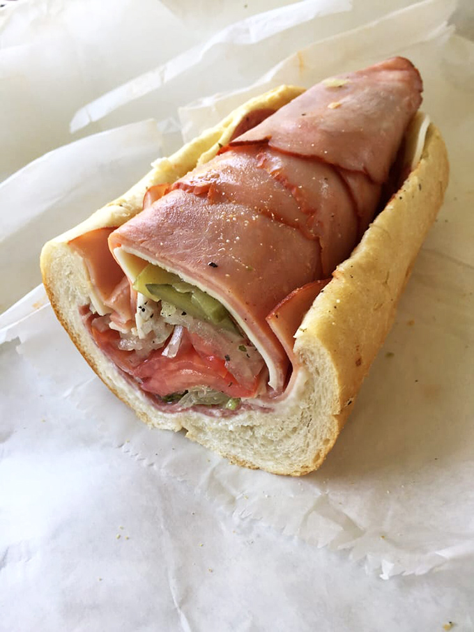 An Italian hoagie that belongs in a museum of sandwich perfection &ndash; layers of meat, cheese, and veggies creating that perfect harmony of flavors.