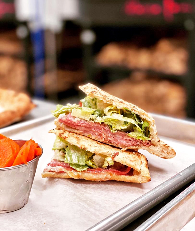 This Italian sandwich has more layers than a Scorsese film. Each bite delivers a perfect ratio of meats, veggies, and that house dressing you'll be thinking about tomorrow.