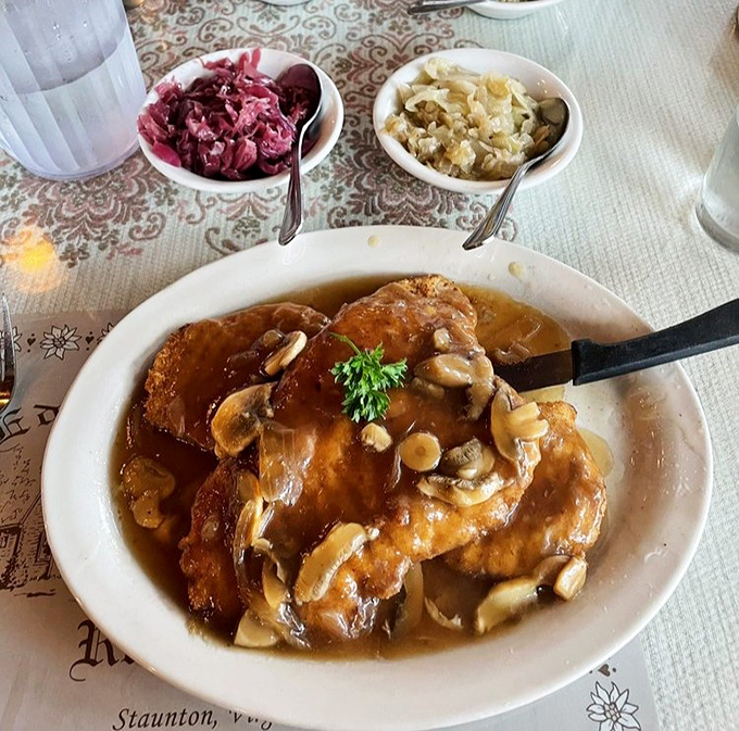 The J&auml;gerschnitzel arrives swimming in mushroom gravy like it's training for the Olympics. That red cabbage adds the perfect sweet-tart counterpoint to the richness.