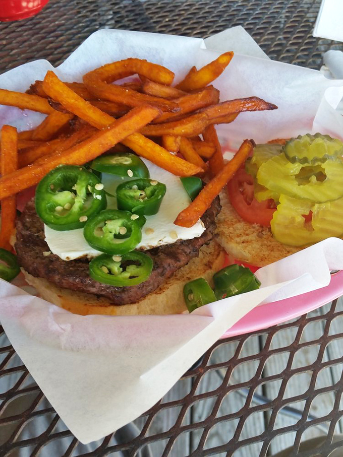 A burger that doesn't whisper, it announces itself&mdash;crowned with jalape&ntilde;os that mean business and sweet potato fries that deserve their own fan club.