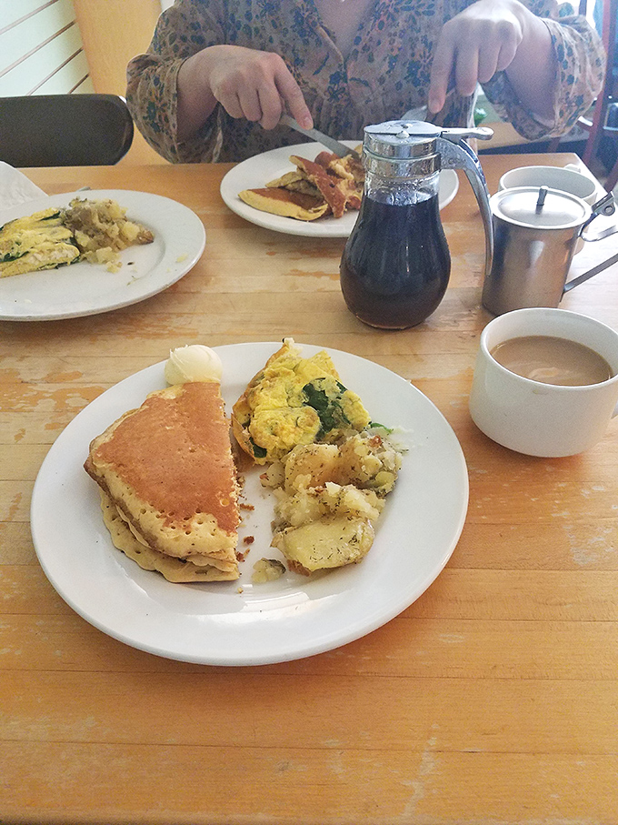 Breakfast geometry at its finest &ndash; golden toast triangles frame a colorful omelet bursting with vegetables and melted cheese that stretches with each forkful.