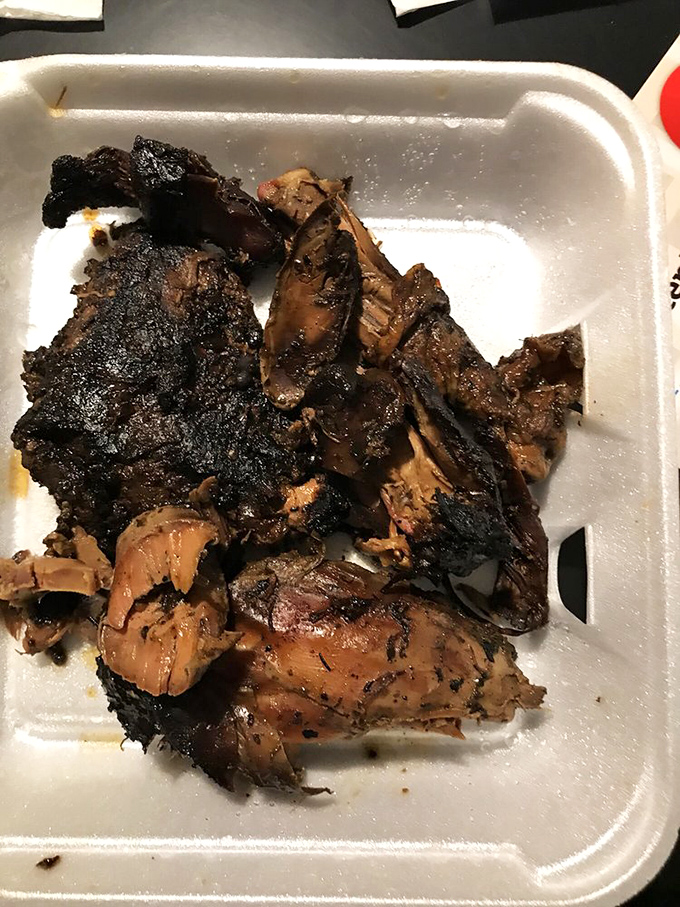 Jerk chicken with that perfect char, speaking the universal language of smoke and spice. Some food doesn't need translation&mdash;just napkins.