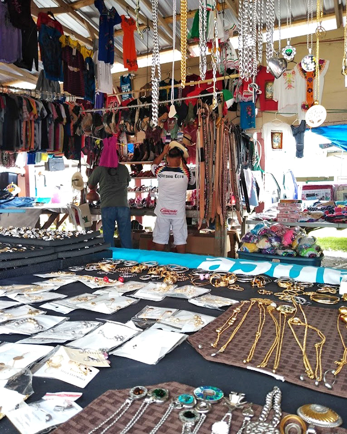 Jewelry displays glitter under the market lights, where shoppers can find everything from costume pieces to potential family heirlooms.