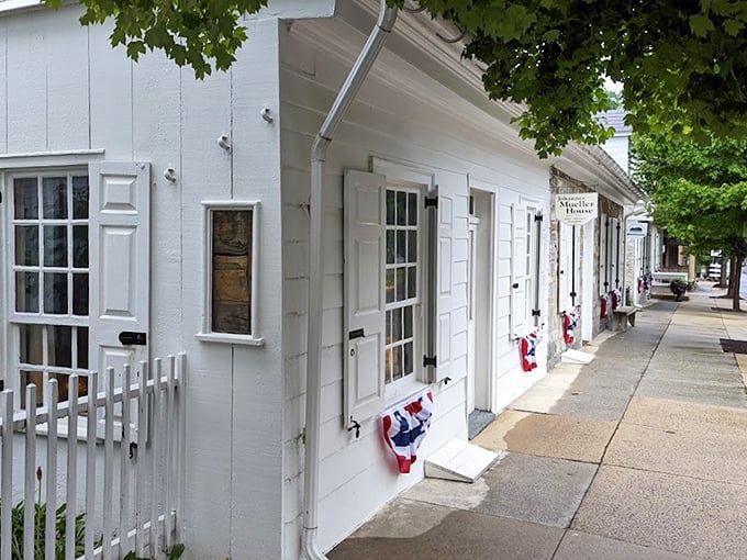 The pristine white Mueller House stands as Lititz's time machine—just look at those shutters! Colonial craftsmanship that would make Martha Washington swoon.