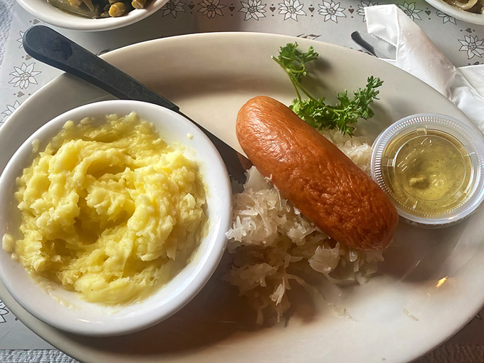 A proper German sausage with sauerkraut and mashed potatoes&mdash;comfort food that transcends language barriers and makes you want to yodel with delight.