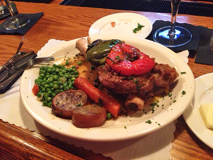 Lamb that doesn't just fall off the bone—it practically leaps onto your fork, surrounded by vegetables that didn't die in vain.