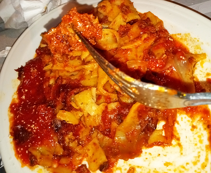 Lasagna that's built like the Great Wall of Cheese—layer upon magnificent layer. This architectural marvel of pasta would make any Italian grandmother weep with pride.