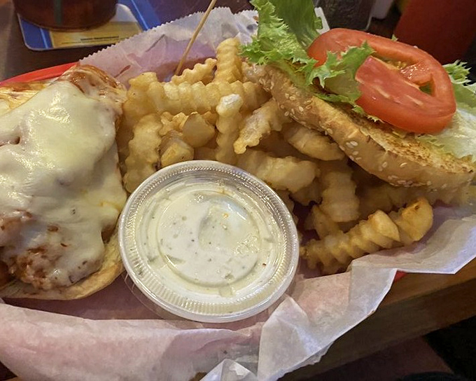 A sandwich that encourages laziness? Count me in! Crispy chicken nestled between fresh veggies and melty cheese &ndash; worth every napkin.