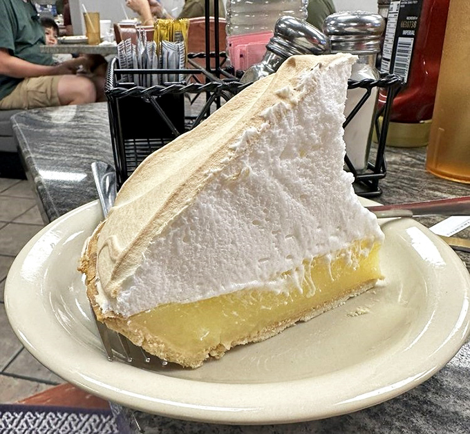 Lemon meringue so tall it needs its own zip code - this is dessert engineering.