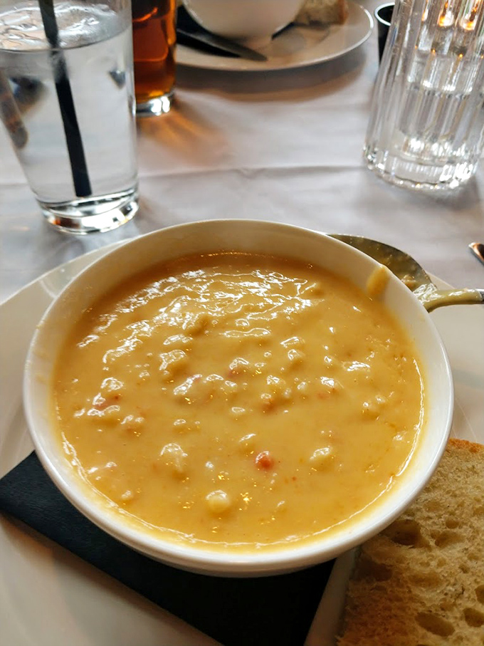 Lobster bisque so rich it should have its own tax bracket. The sherry and cream create a velvety stage where chunks of lobster perform their delicious dance. 